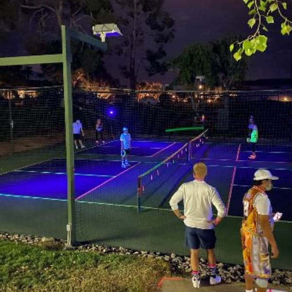 Light Up the Night: Glow in the Dark Pickleball Sets!